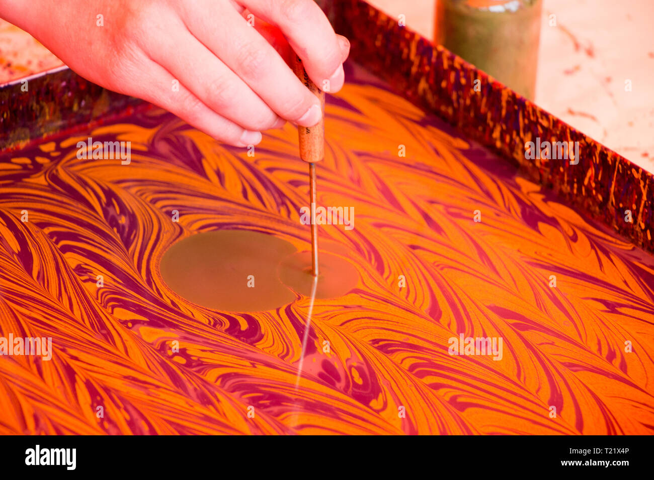 Hand drawing with stick stained inks on water surface Stock Photo - Alamy