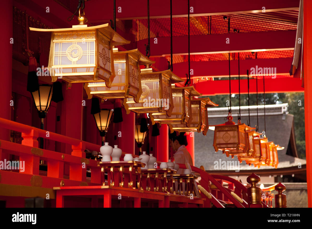 Offerings laid out in a shrine at the entrance to Fushimi Inari, with ...