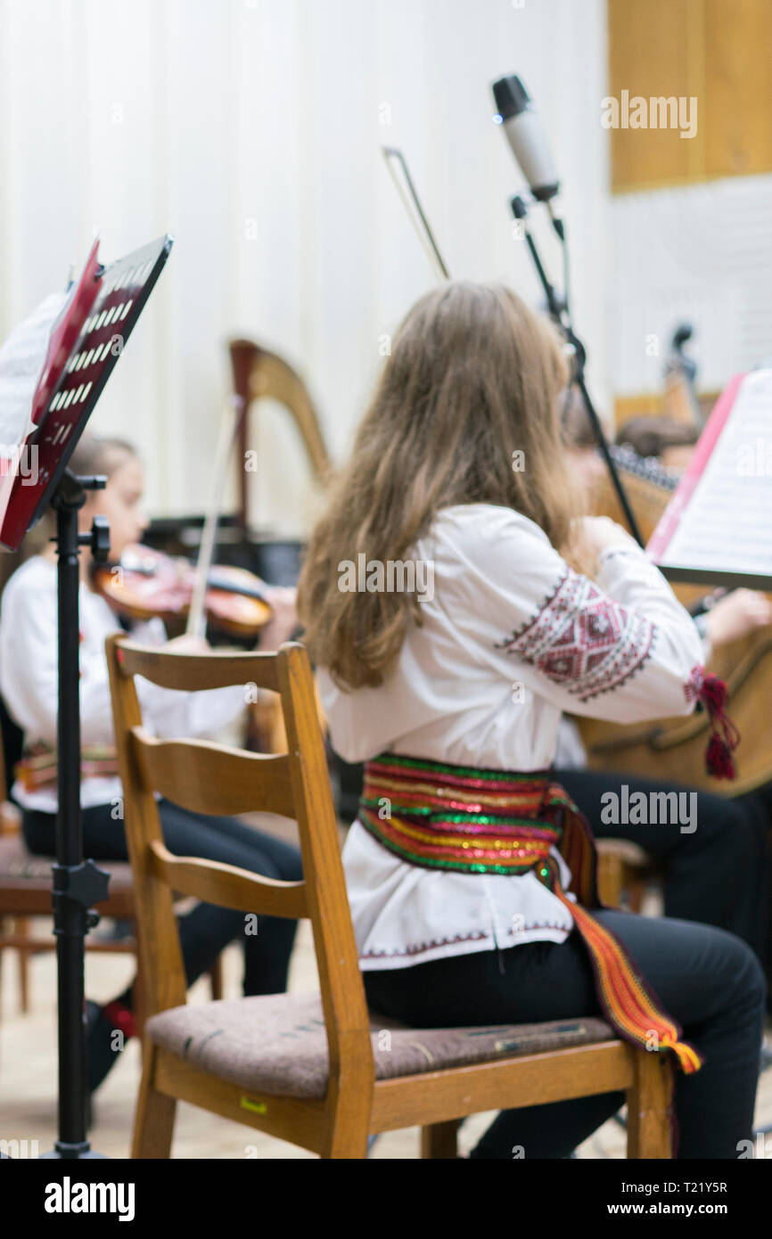 violin ensemble on stage. vertical photo Stock Photo - Alamy