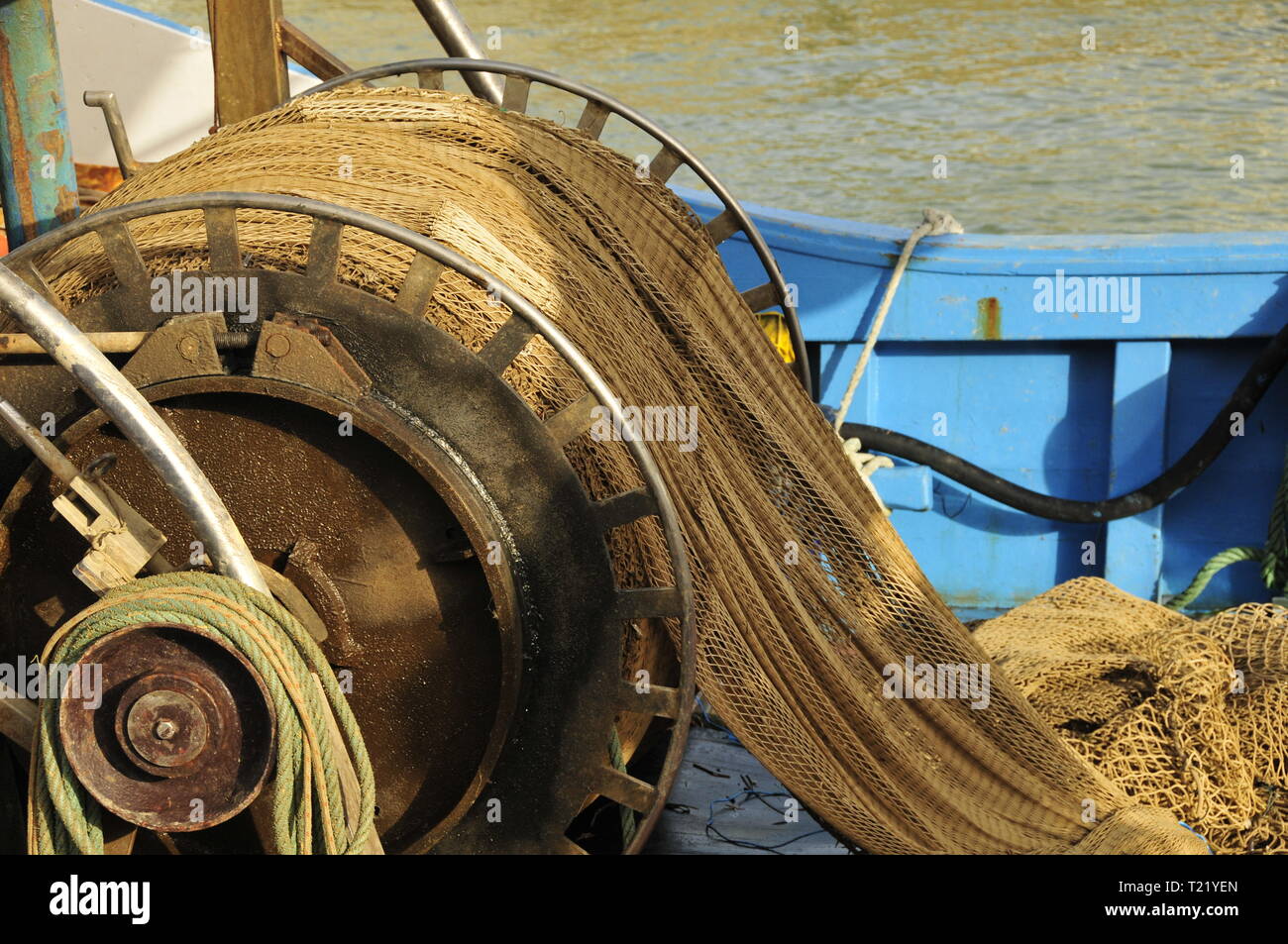 Fishing net on a fishing cutter is pulled in via an iron roller Stock ...