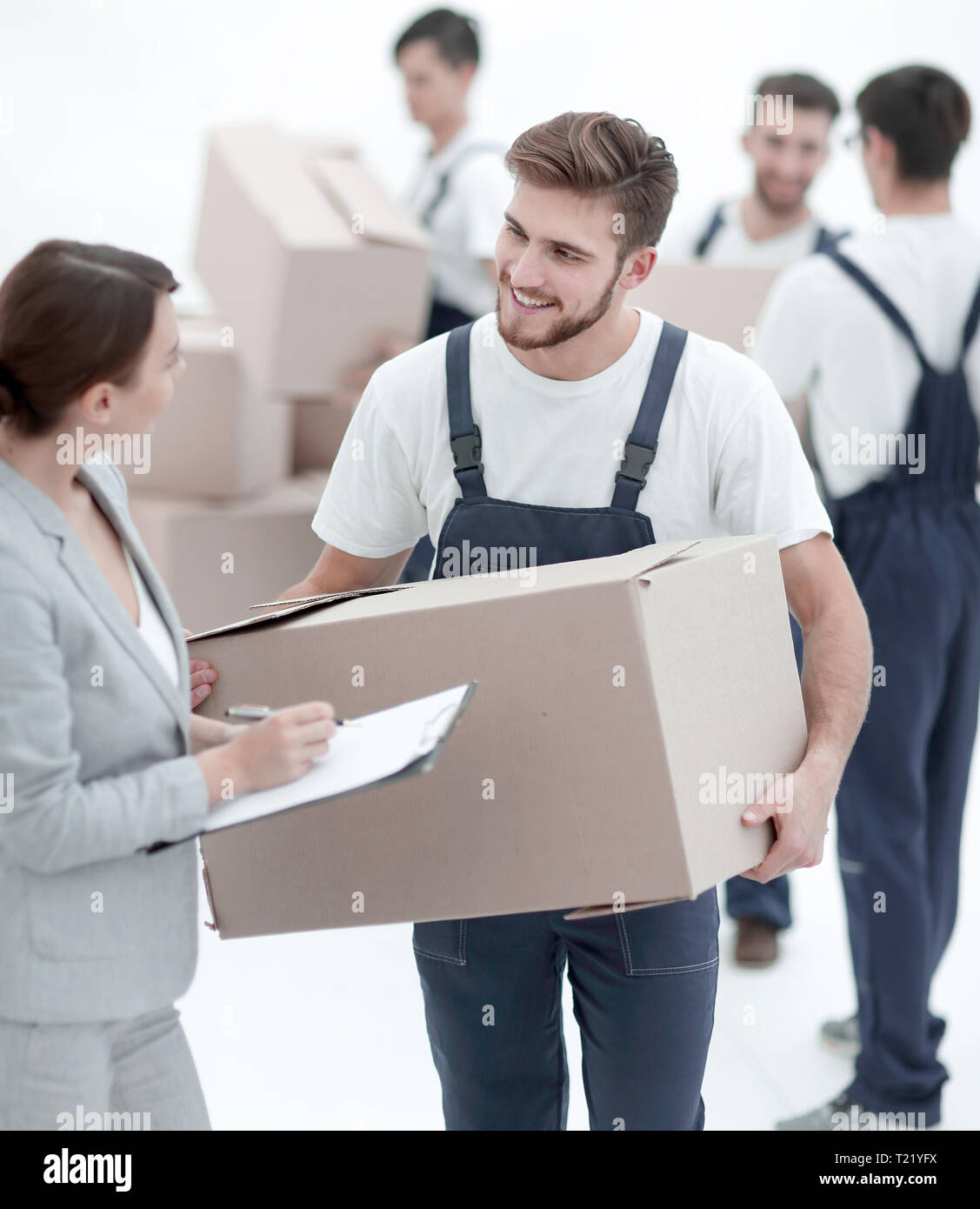 Manager and movers isolated on white background Stock Photo - Alamy