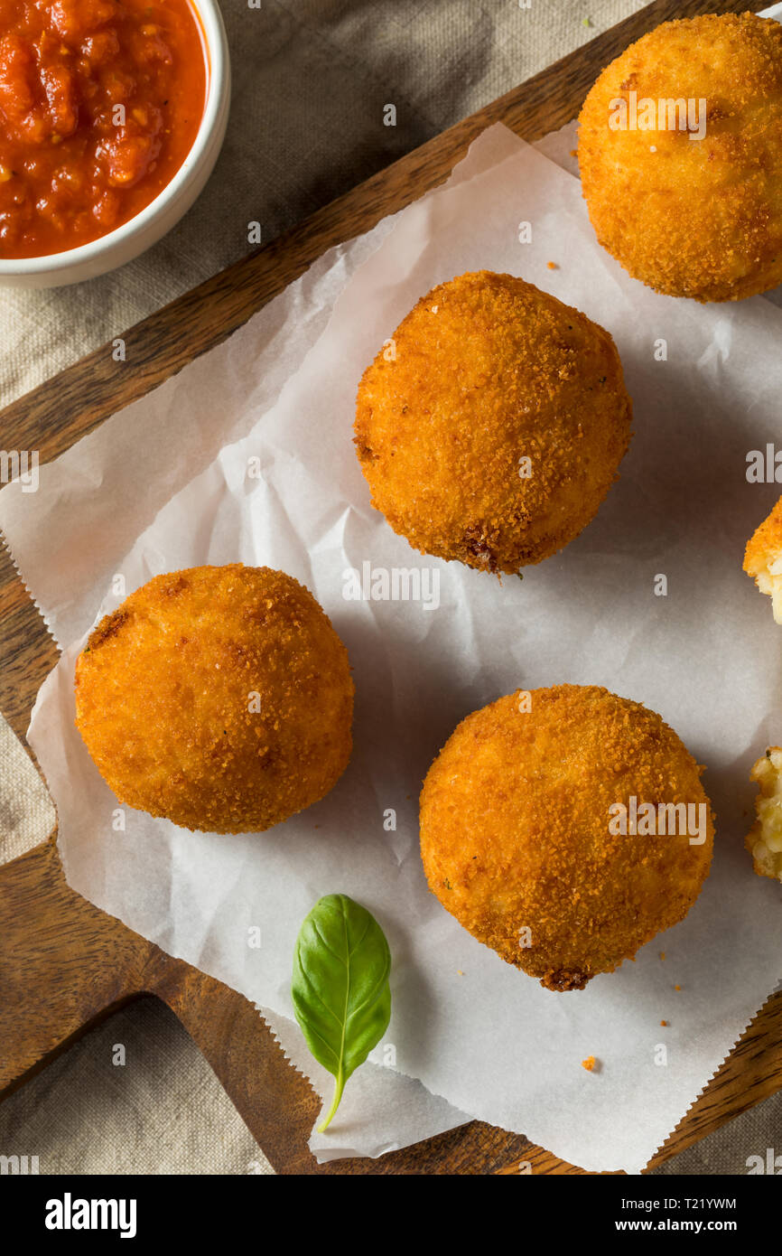 Homemade Deep Fried Risotto Arancini with Basil and Marinara Stock ...