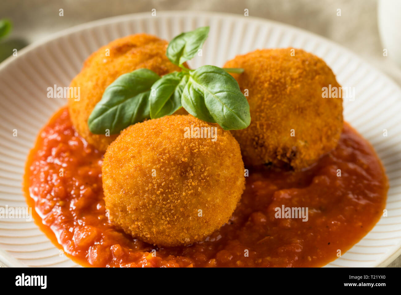 Homemade Deep Fried Risotto Arancini with Basil and Marinara Stock ...