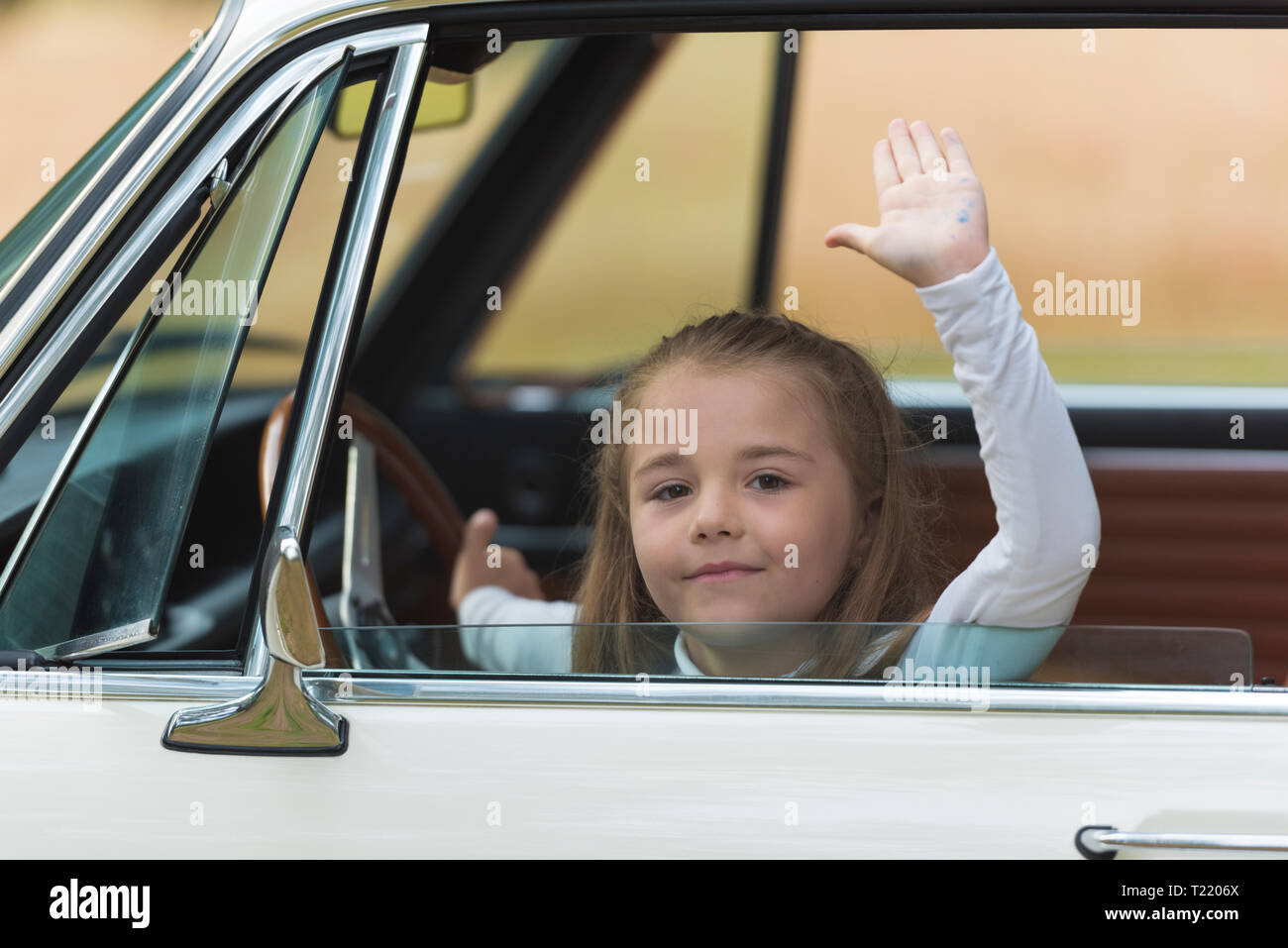 Little girl driving a car Stock Photo - Alamy