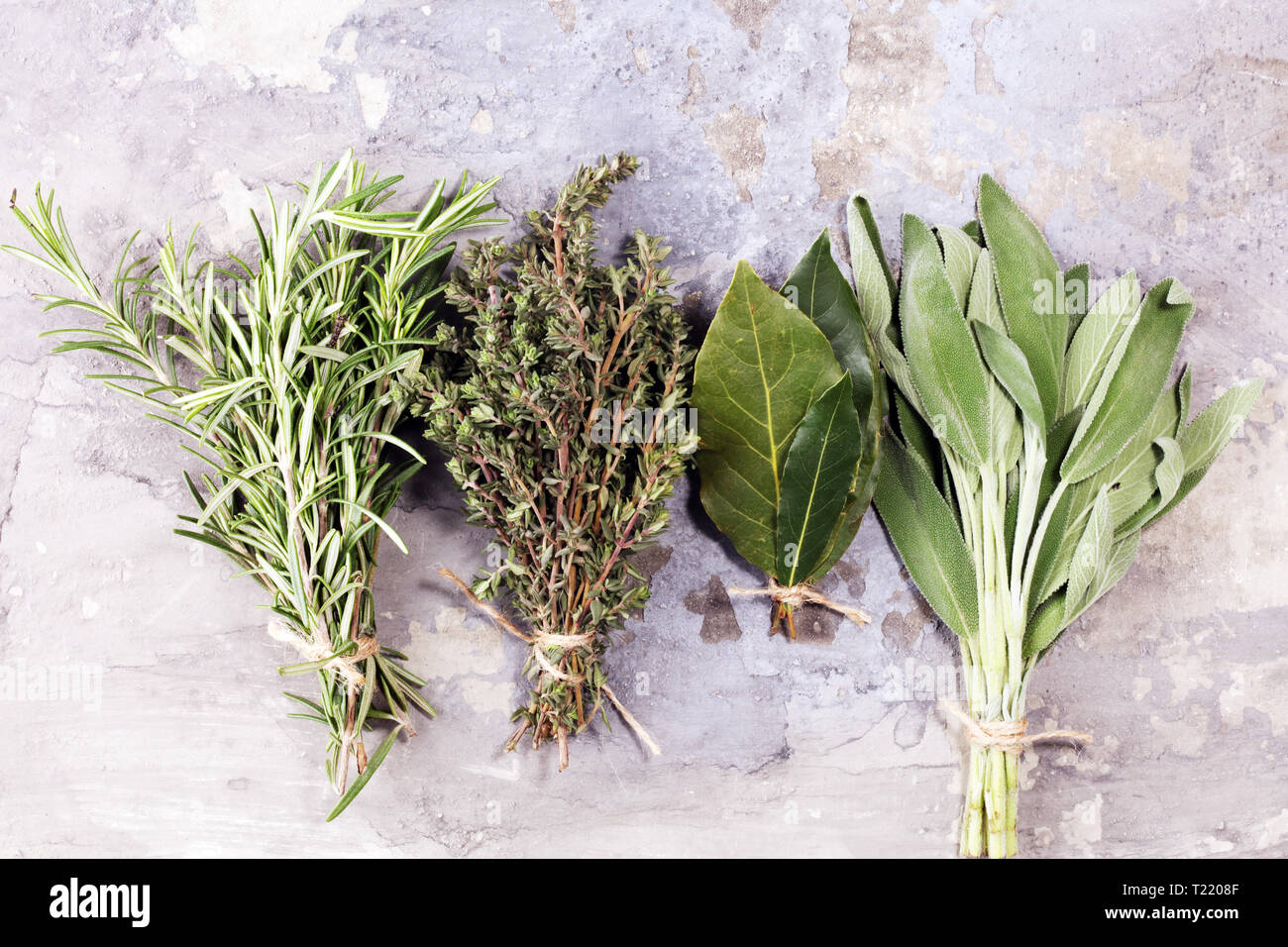 Homegrown and aromatic herbs on rustic background.Set of culinary herbs ...