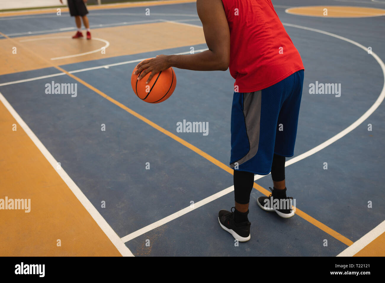 Player playing basketball at basketball court Stock Photo - Alamy