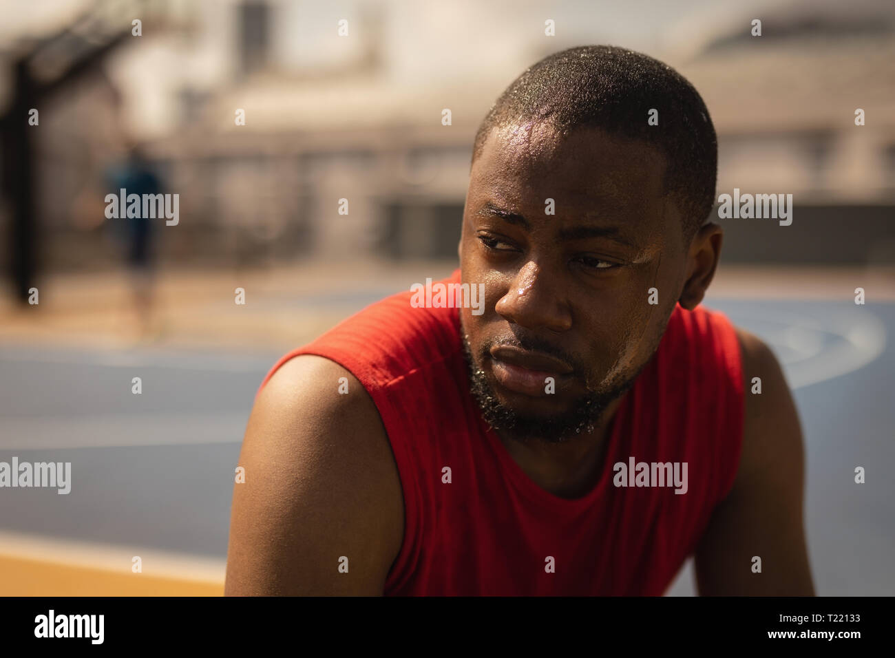 Basketball player relaxing at basketball court Stock Photo - Alamy