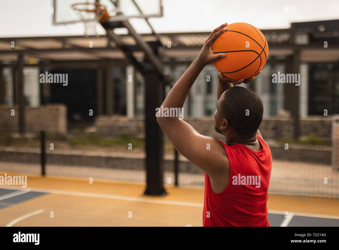 Basketball player playing basketball at basketball court Stock Photo ...