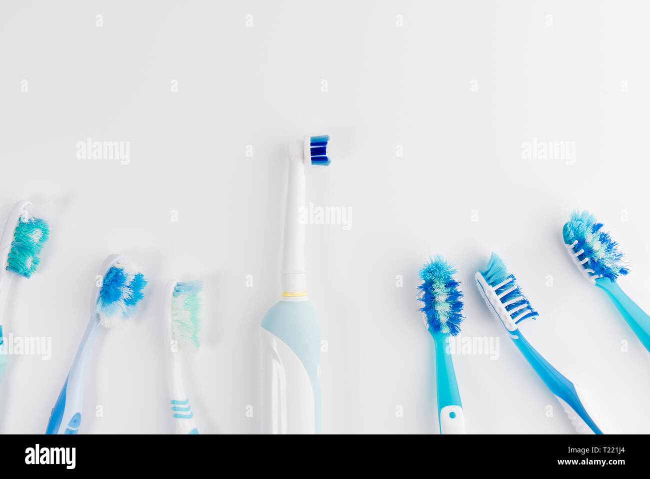 Manual regular Toothbrush Against Modern Electric Toothbrush. Isolated ...