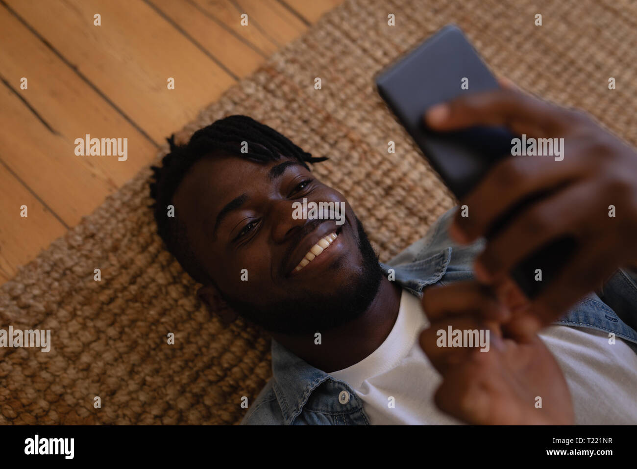 Lying on floor hi-res stock photography and images - Alamy