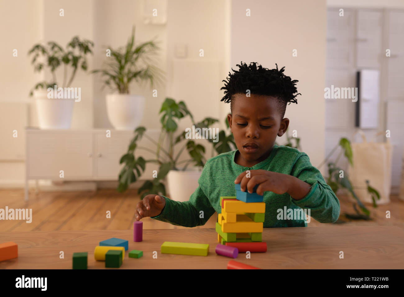 Little cute boy playing with building blocks Stock Photo - Alamy