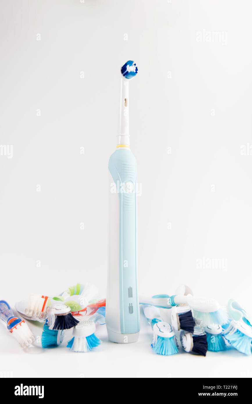 Manual regular Toothbrush Against Modern Electric Toothbrush. Isolated ...