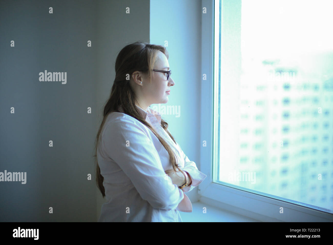 Executive business woman looking out the office window.photo with copy ...