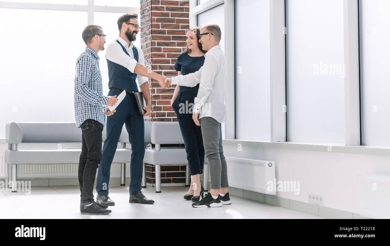 handshake business colleagues in the office lobby.photo with copy space ...