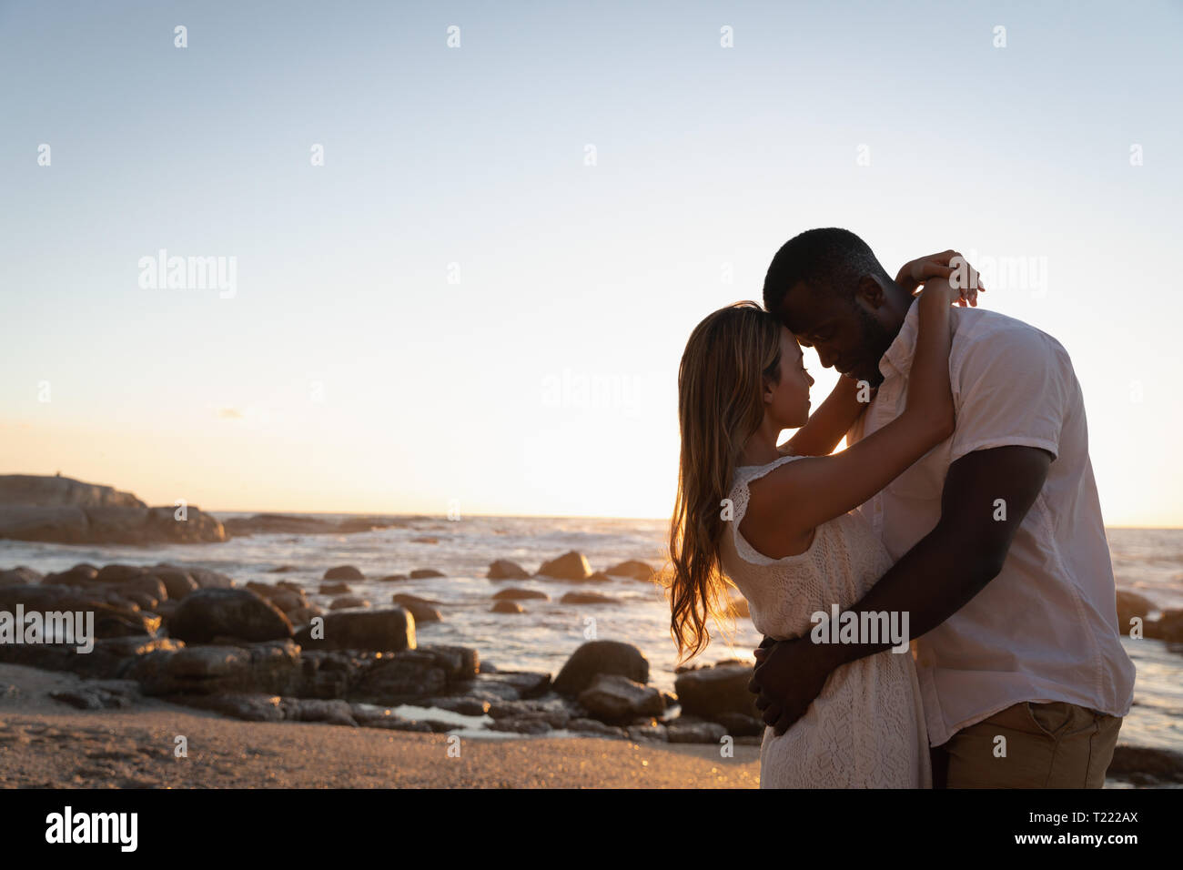 Couple embarrassing each other at beach on a sunny day Stock Photo - Alamy