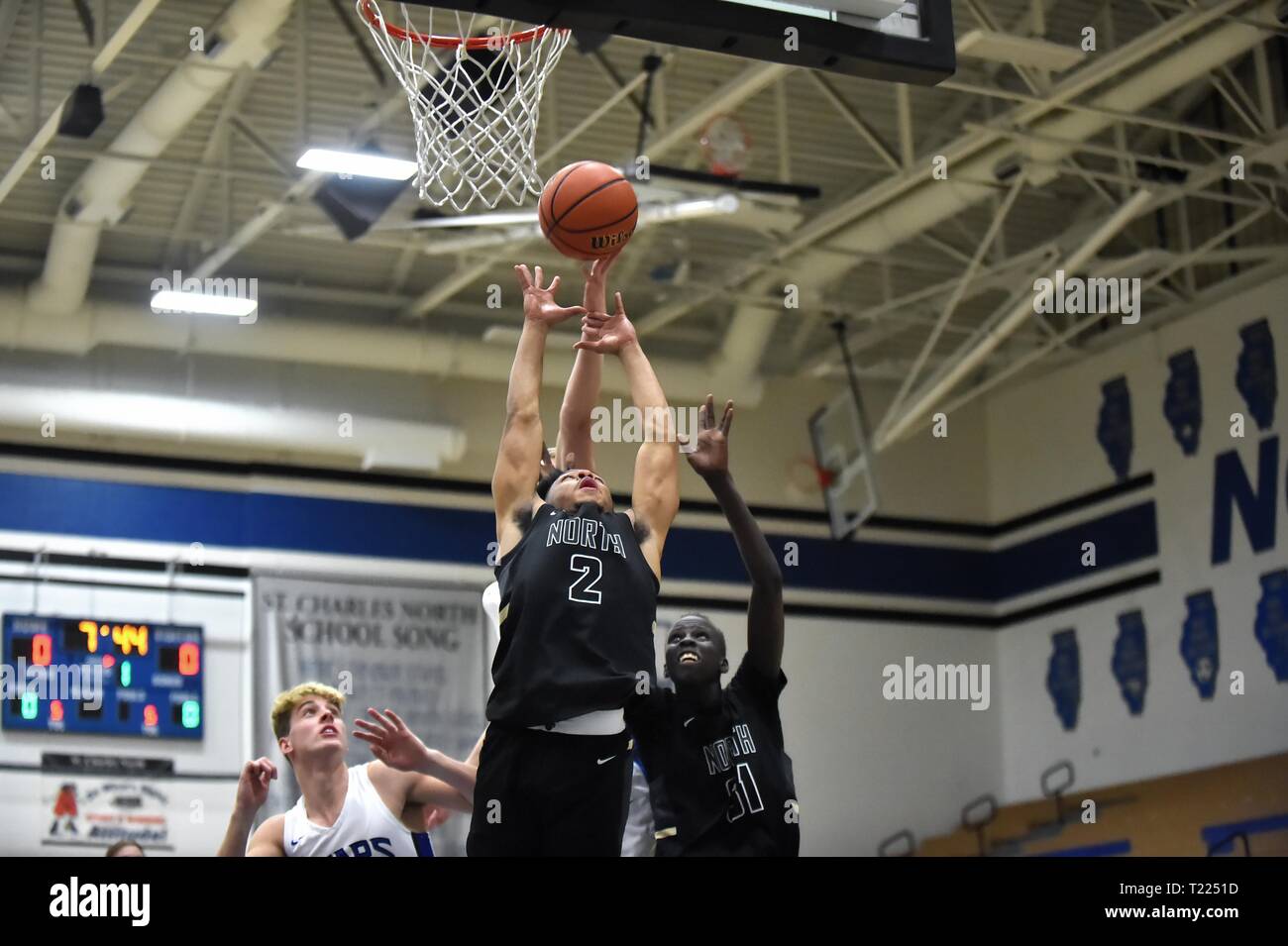 Player in the process of pulling down a rebound off his own boards. USA ...