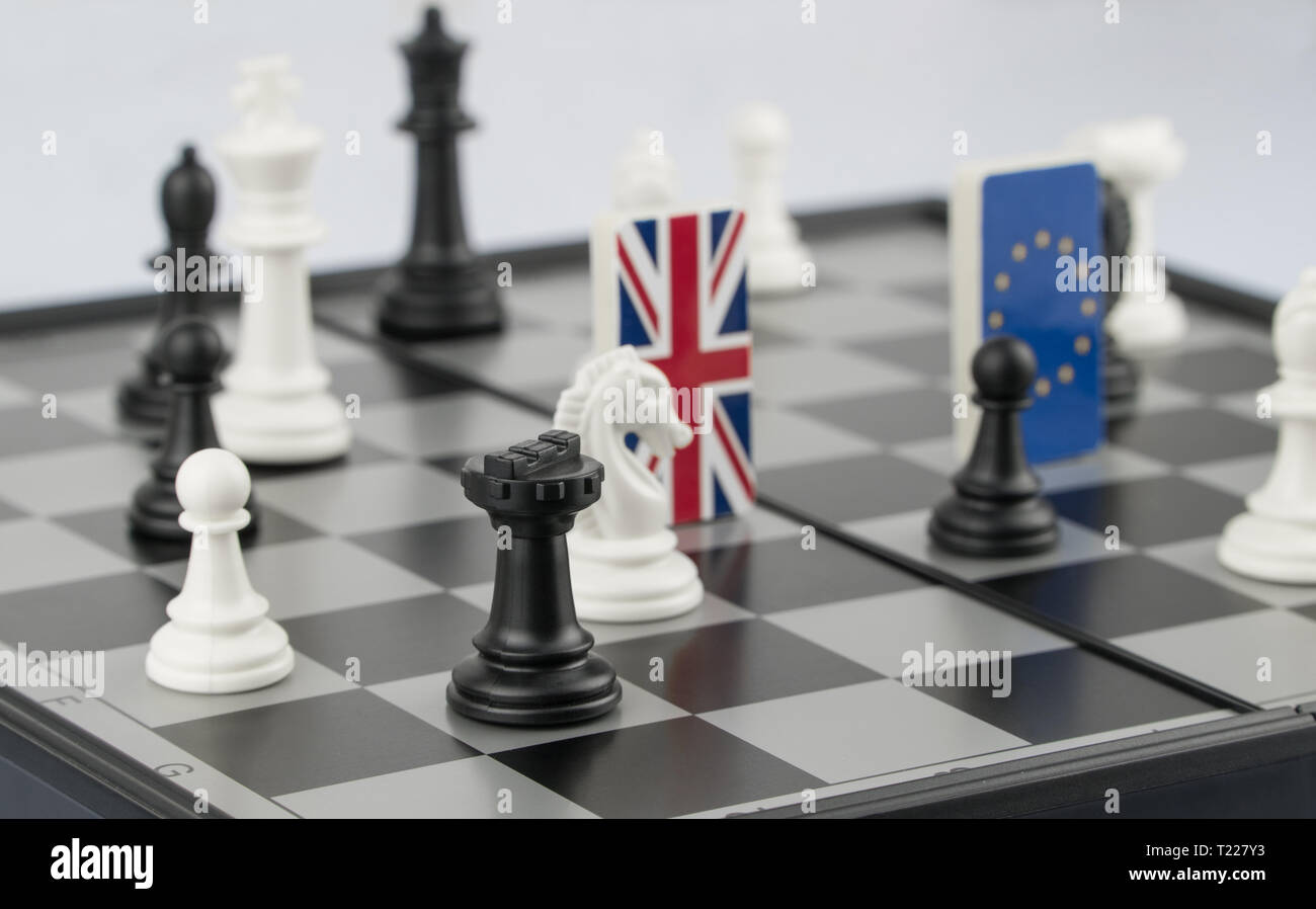 Chess pieces and flags of the European Union and the UK on a chessboard ...