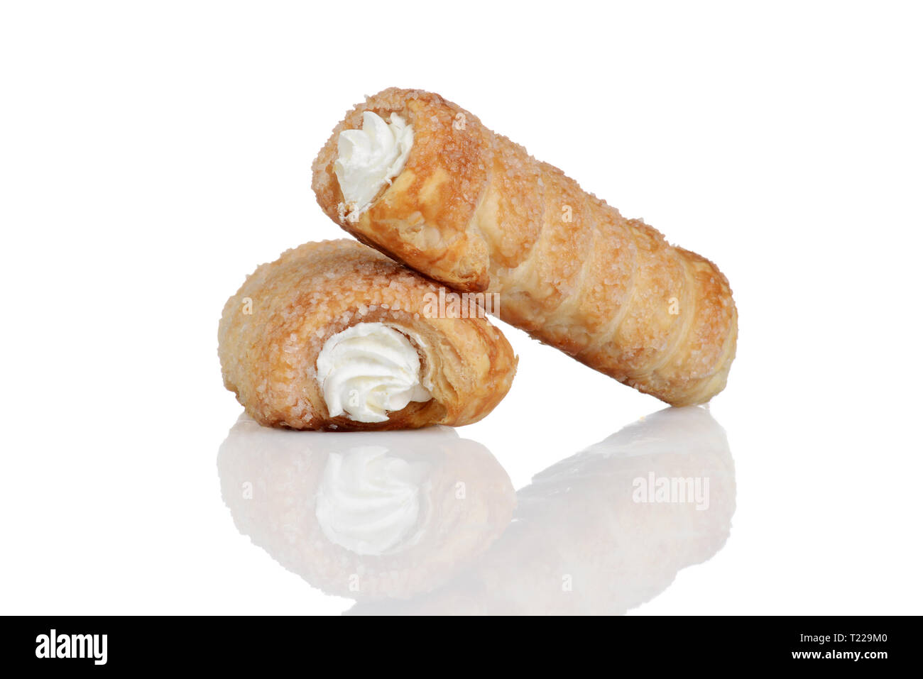 two cream filled cannoli Stock Photo - Alamy