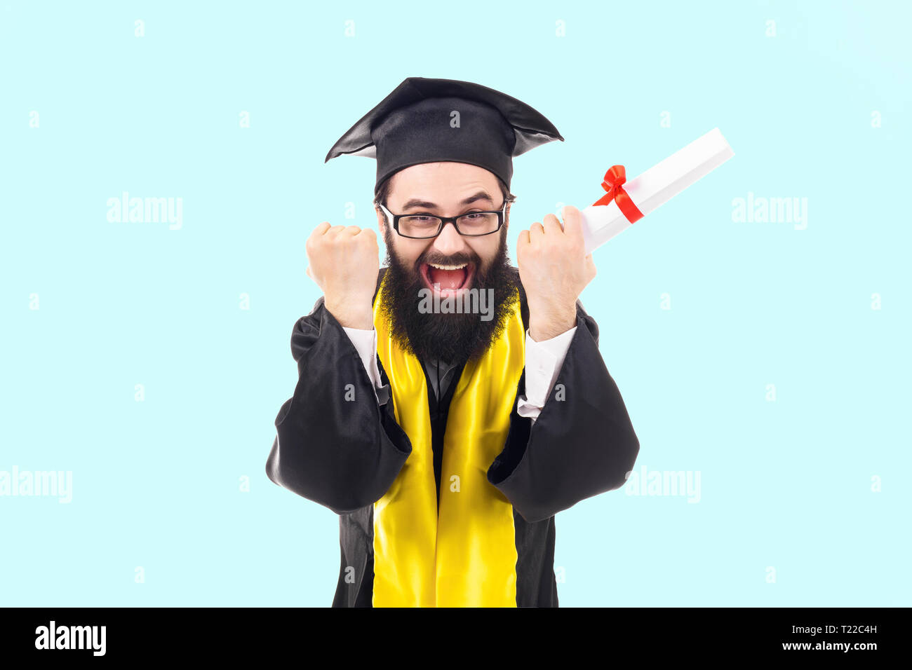graduate with a diploma in hand, rejoices at successful completion of ...
