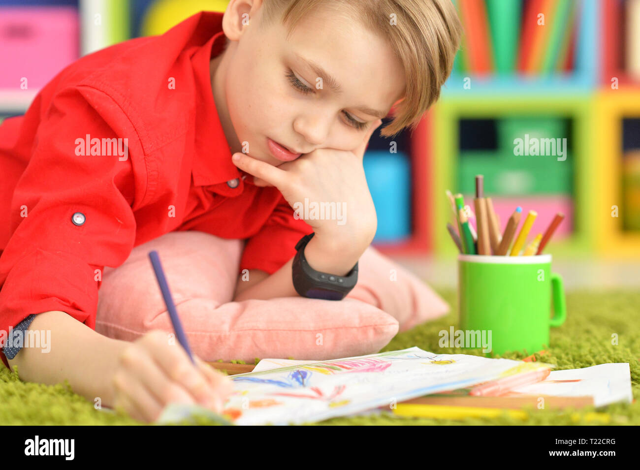 Portrait of cute little boy drawing with pencils at home Stock Photo ...