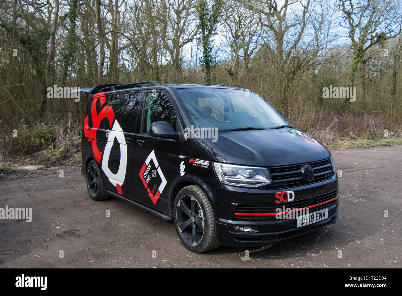 Film crew van photographing an Aston Martin sports car in Salsey forest ...