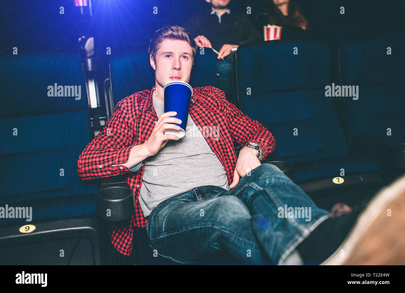 A picture of guy is sitting in chair in position of calm amd relaxation ...