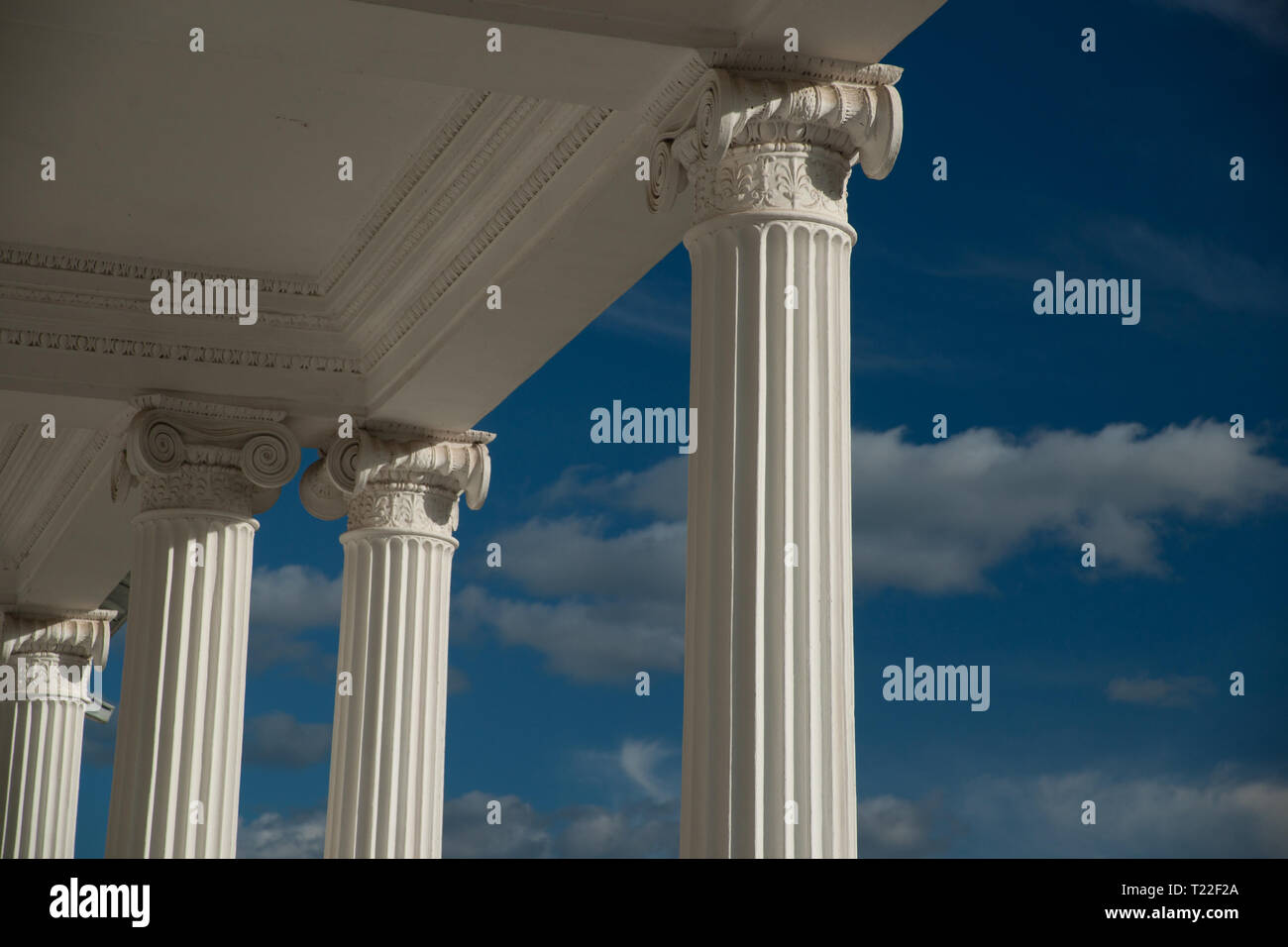 Columns on blue sky background. architectural background Stock Photo ...
