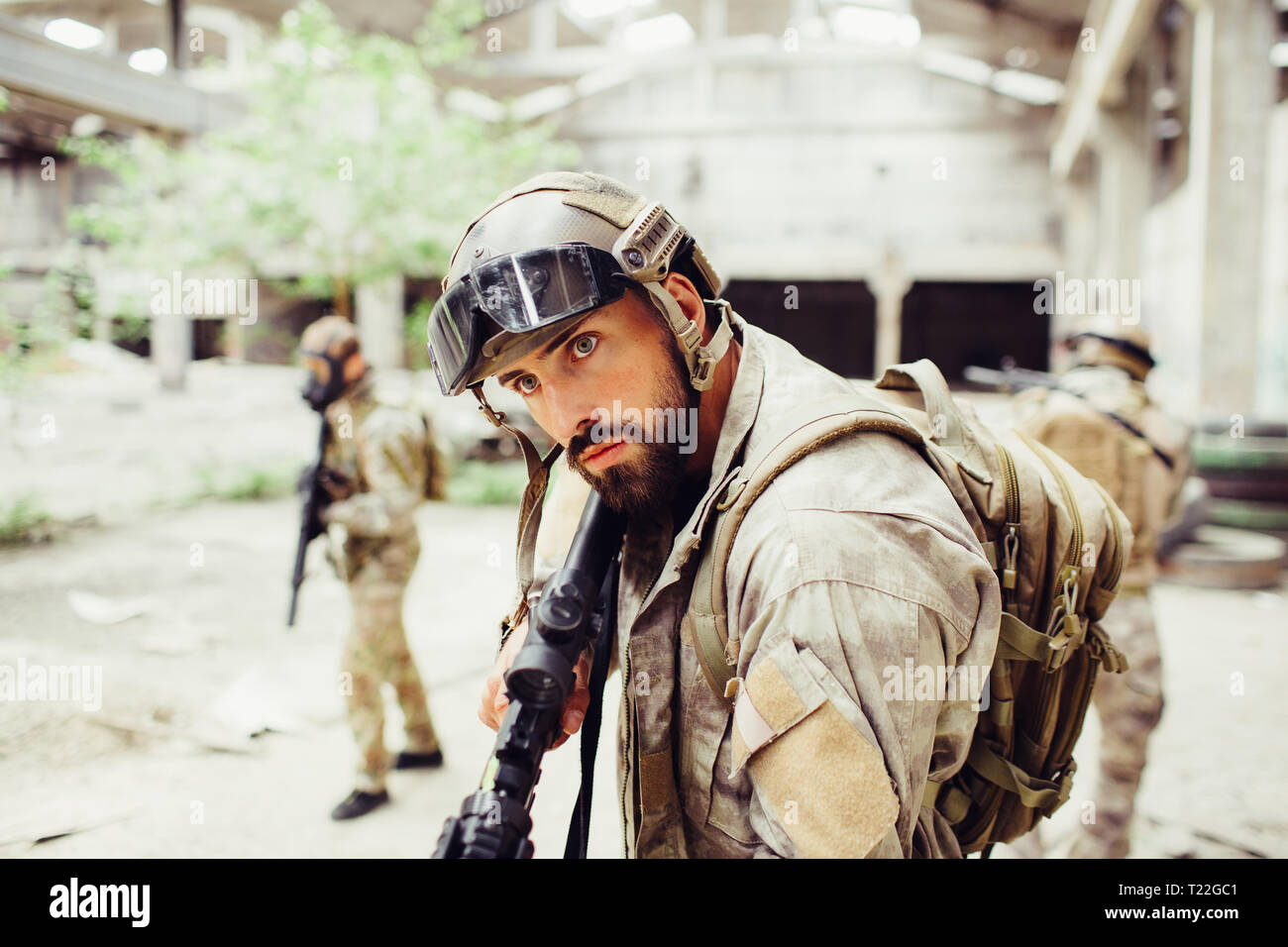 Serious and concentrated warrior is standing and looking straight ...