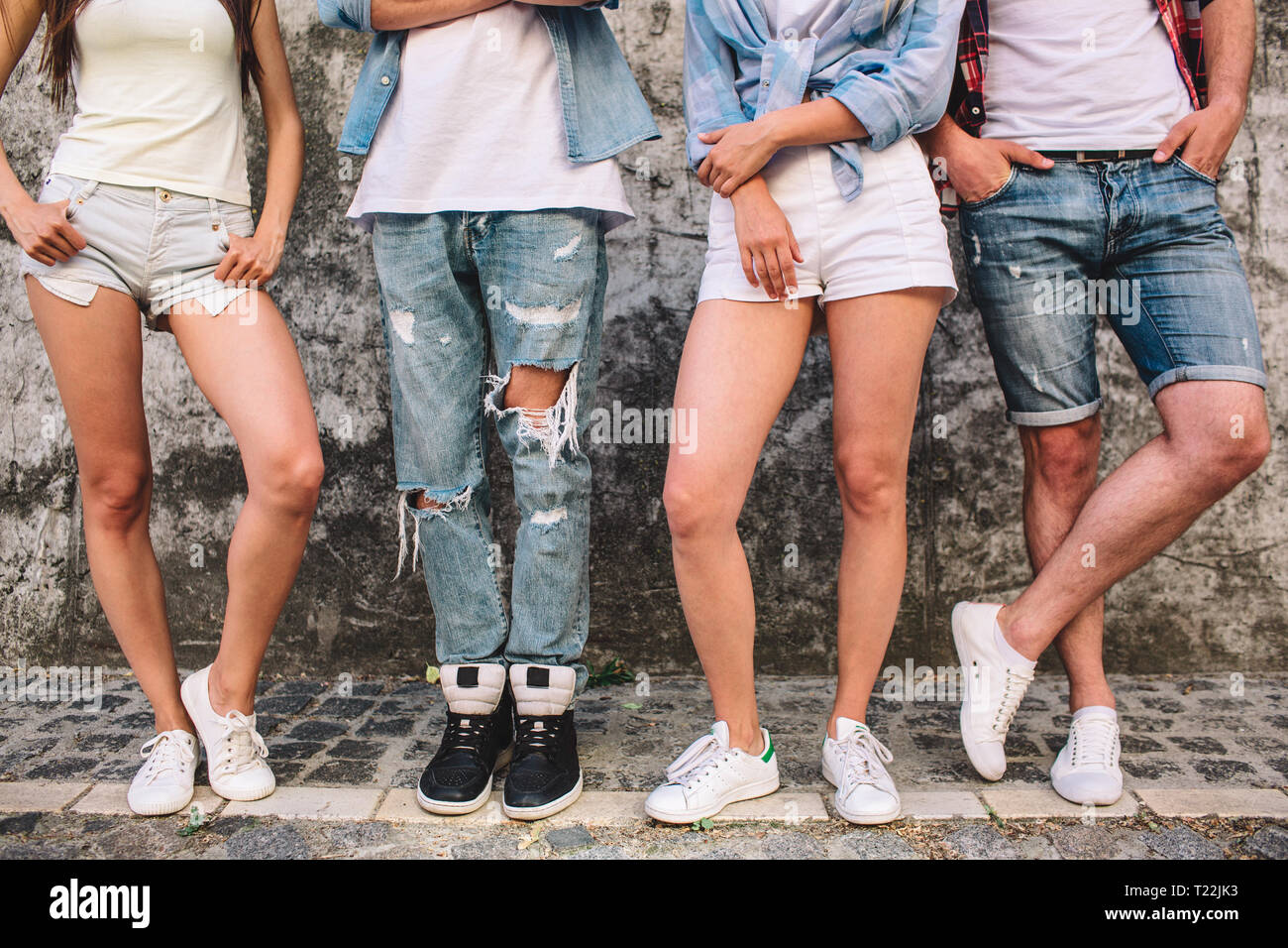 Another picture of people's legs. These human beings are posing on ...