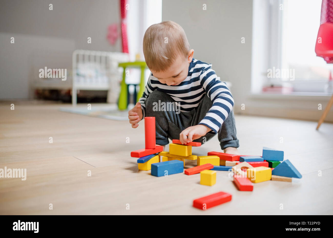 Toddler boy playing with building blocks at home Stock Photo - Alamy