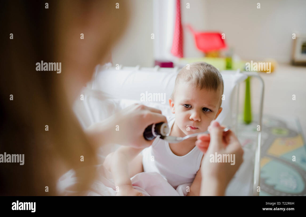 Giving medicine hi-res stock photography and images - Alamy