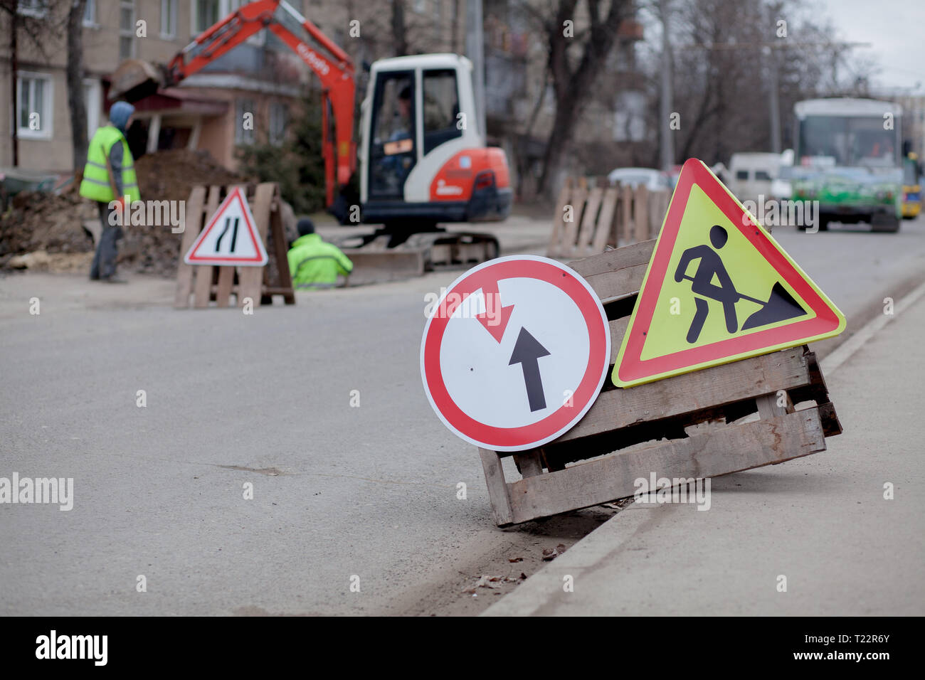 Road signs, detour, road repair on street background, truck and ...