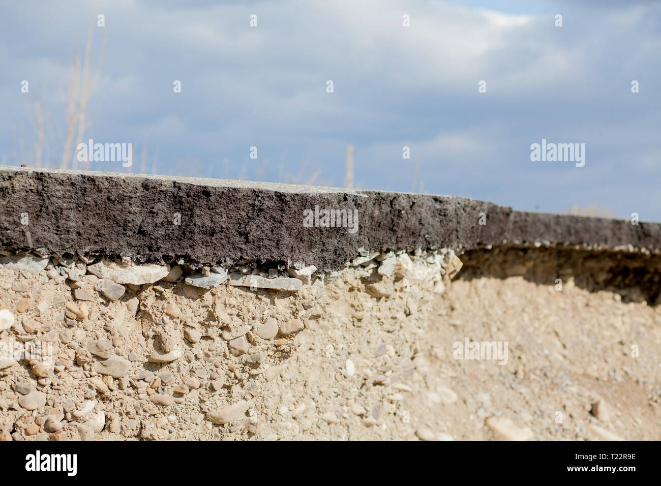 Cross section of asphalt road with blue sky background Stock Photo - Alamy