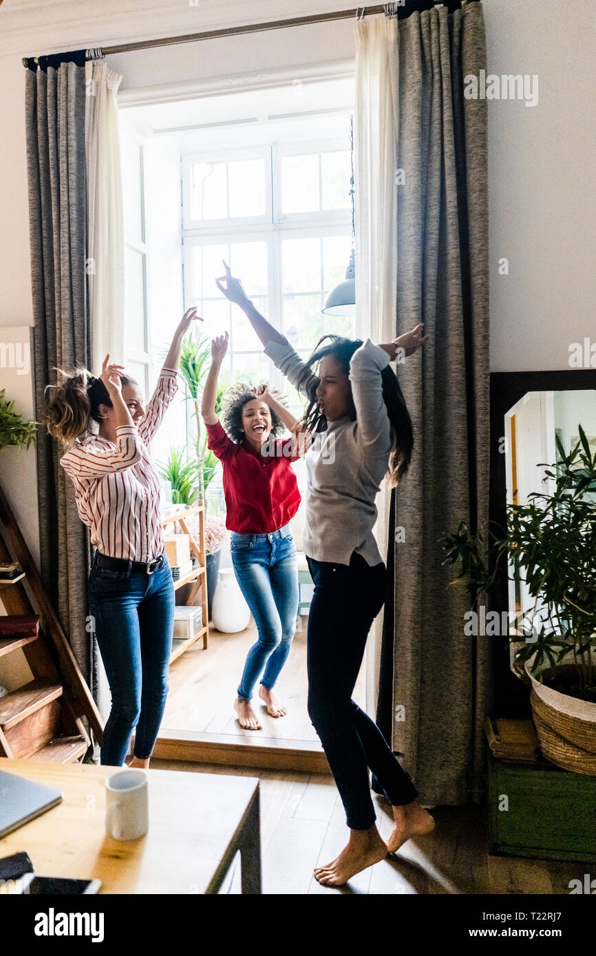 Three friends at home, living together Stock Photo - Alamy