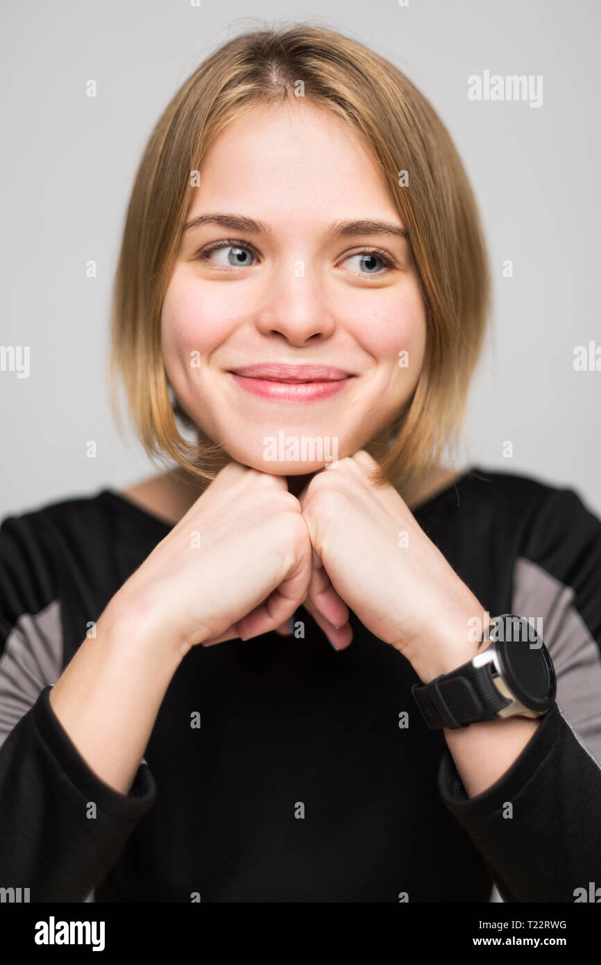 Portrait of smiling blond young woman with bob hairdo Stock Photo - Alamy