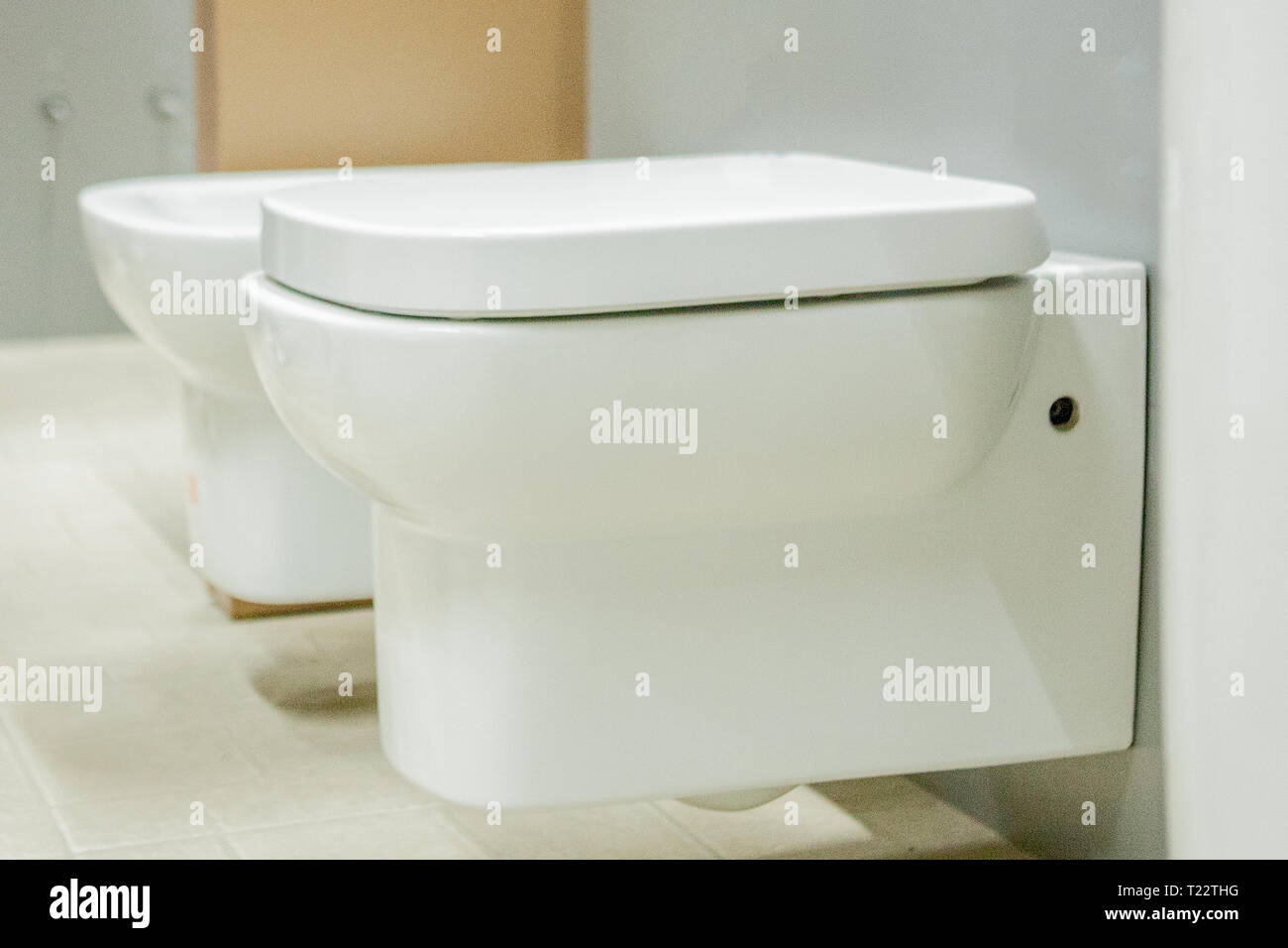 blurred image of toilet bowls aisle in a hardware store Stock Photo - Alamy
