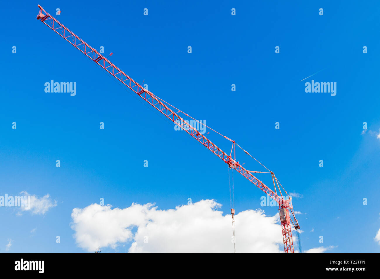 Crane against the blue sky background Stock Photo - Alamy