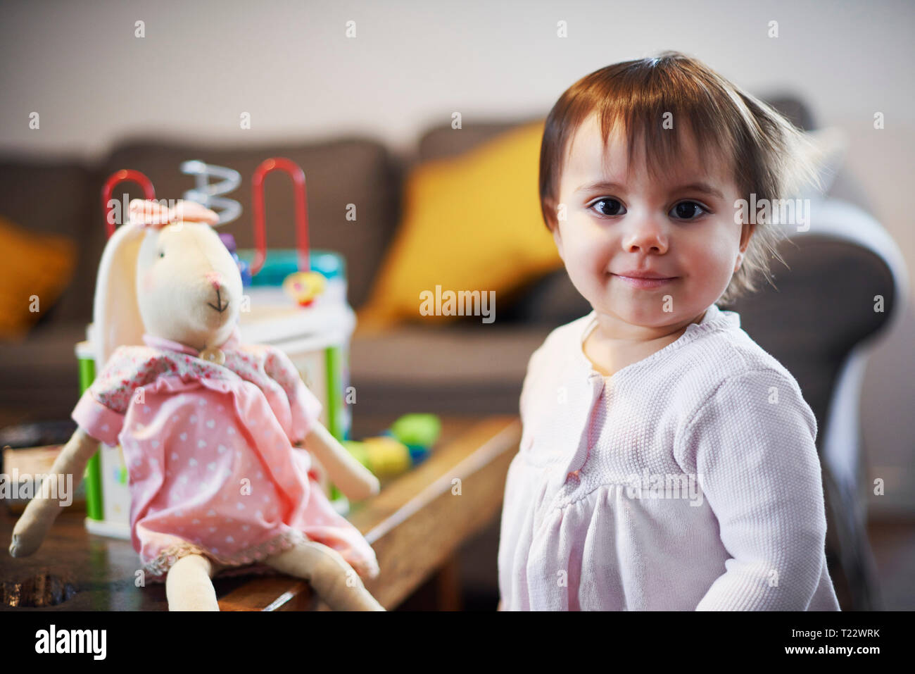 Portrait of cute baby girl at home Stock Photo - Alamy