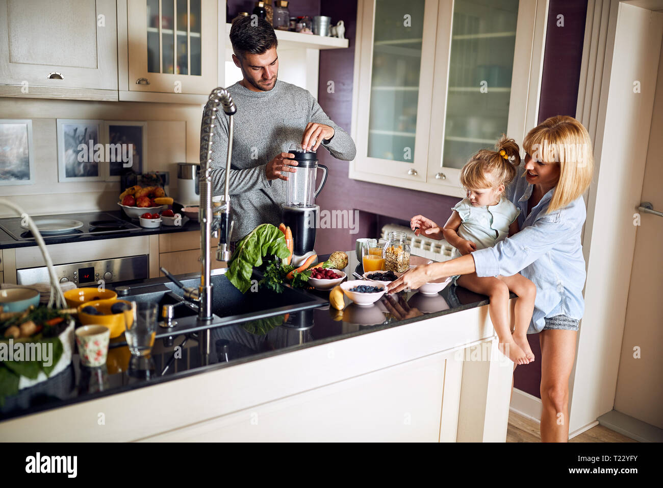 Family in kitchen in the morning preparing healthy breakfast Stock ...