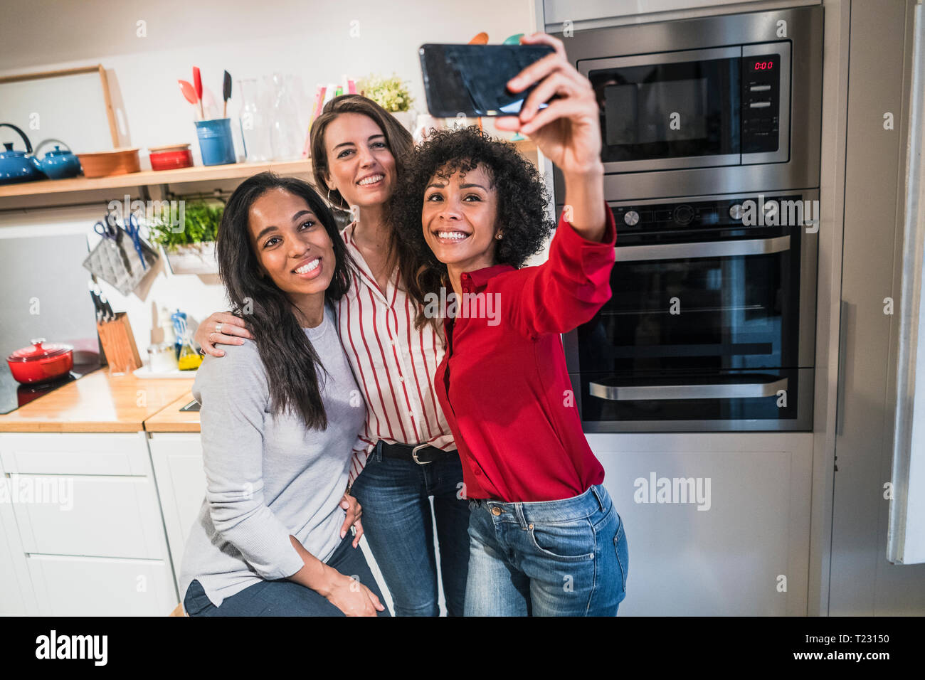 Three friends at home, living together Stock Photo - Alamy