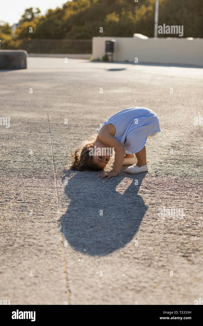 Playful little girl outdoors in summer Stock Photo - Alamy