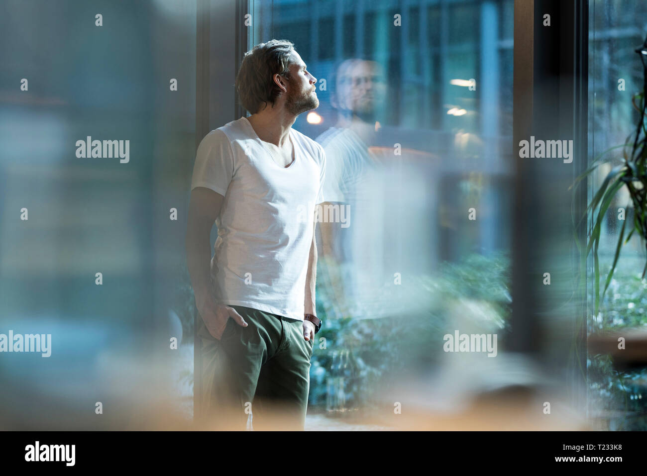 Office building man window hi-res stock photography and images - Alamy