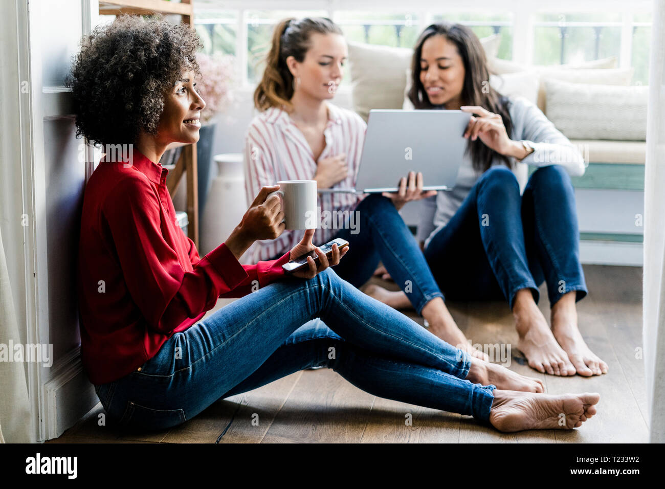 Three friends at home, living together Stock Photo - Alamy