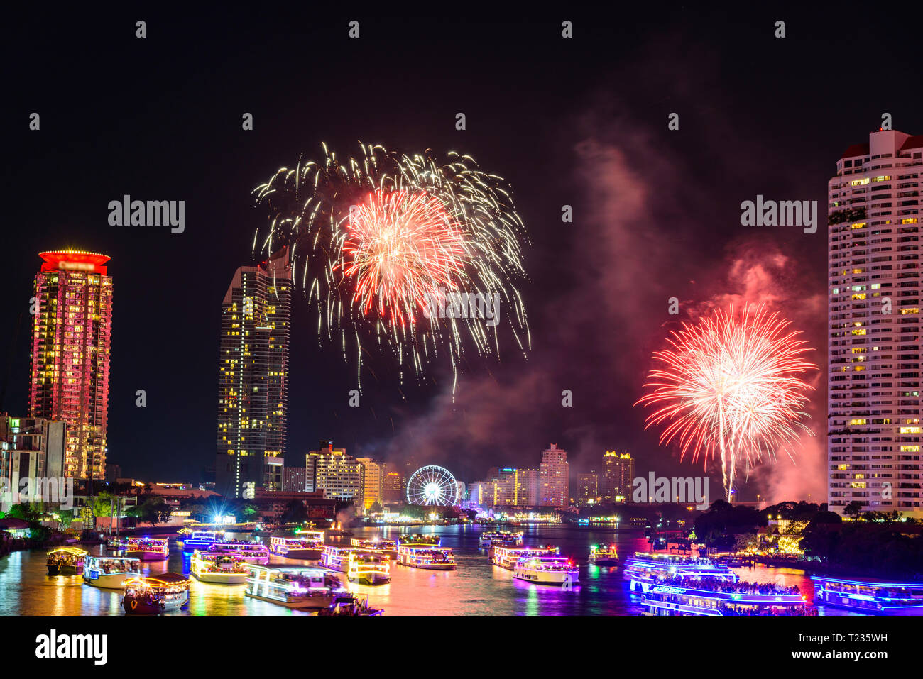Fireworks at the river of city in New Year countdown time Stock Photo ...