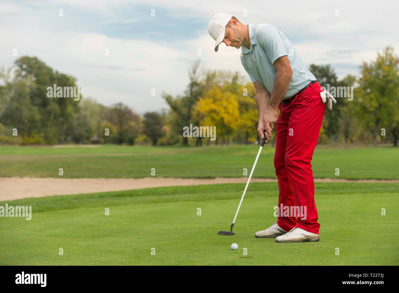 Professional golfer holding ball hi-res stock photography and images - Alamy