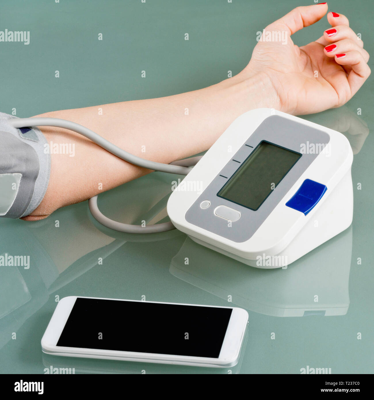 Measuring blood pressure at home, using smart phone to follow results ...