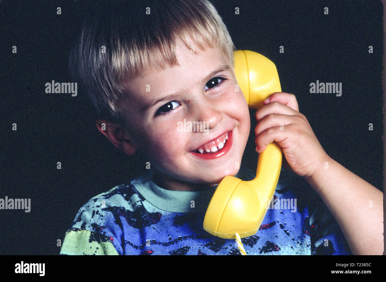 Boy talking on toy hi-res stock photography and images - Alamy