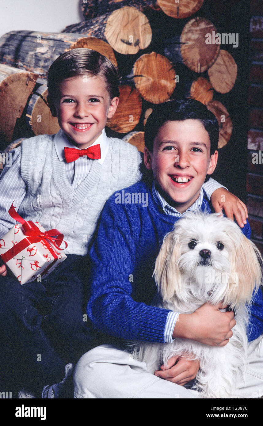Two Brothers and Pet Dog Smile for the Camera, USA Stock Photo - Alamy
