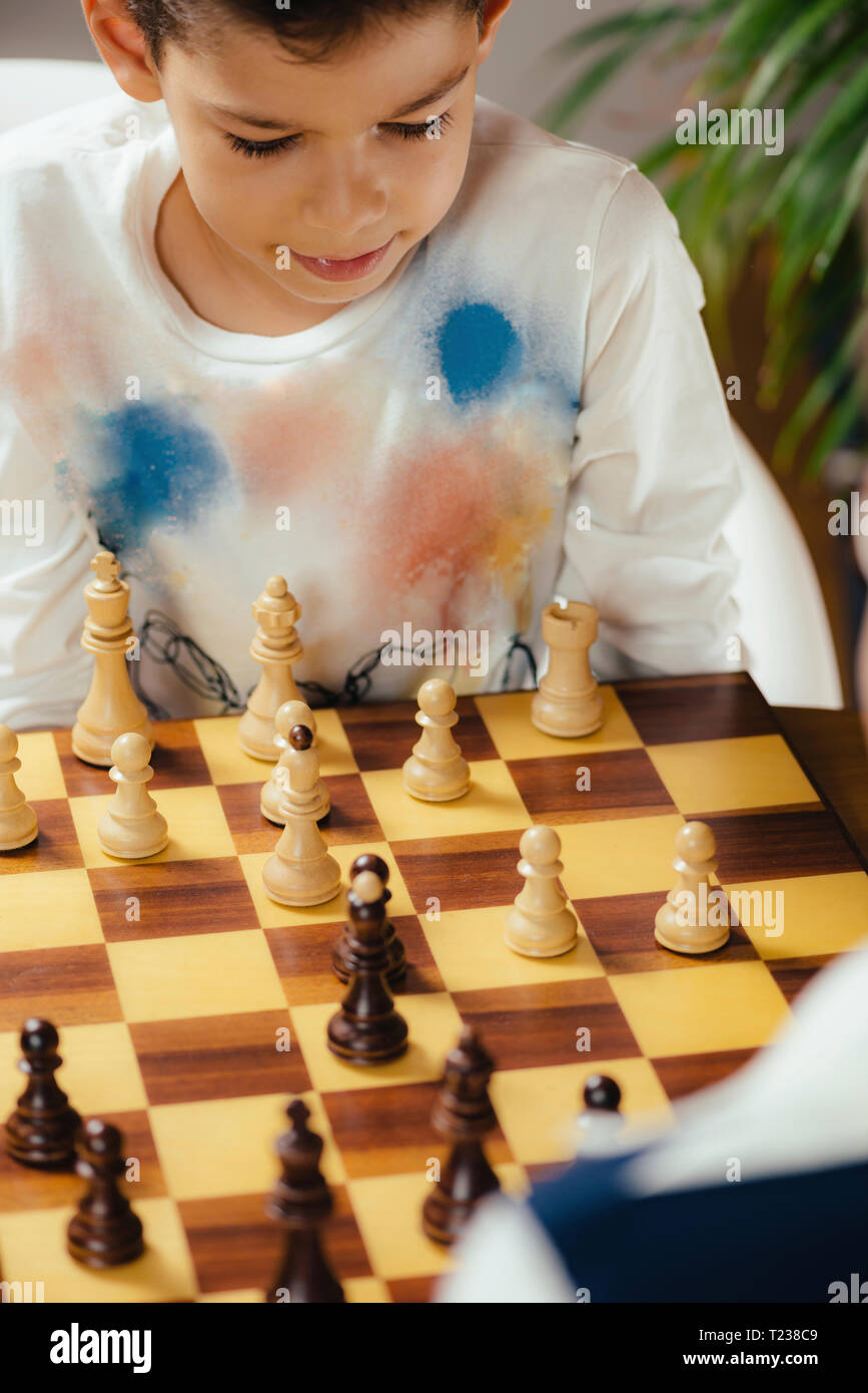 Little friends playing chess, having fun Stock Photo - Alamy