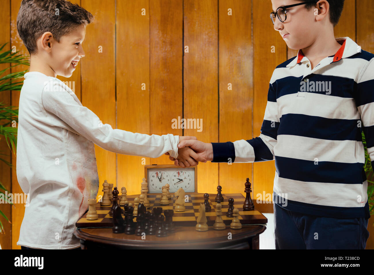 Schoolboys playing chess, having fun Stock Photo - Alamy